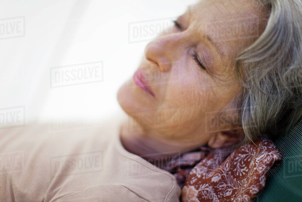 Senior woman napping - Royalty-free Stock Photo | Dissolve