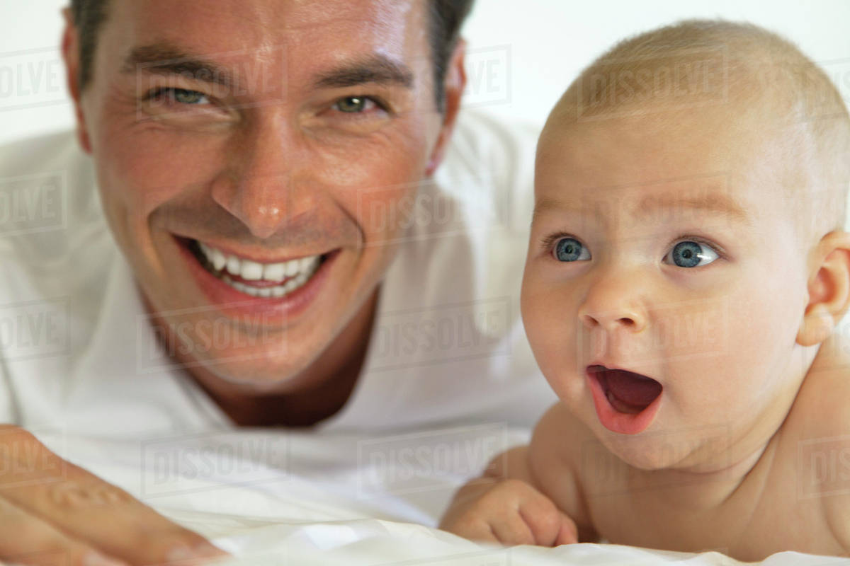 Father and baby laughing together, portrait - Royalty-free Stock Photo ...