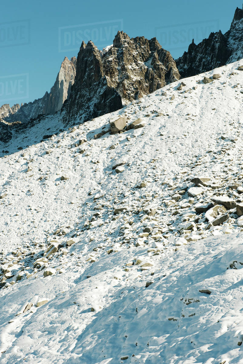 Snowy mountain slope and mountain peak - Royalty-free Stock Photo ...