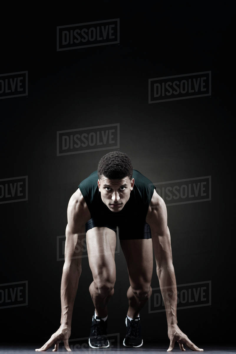 Runner at starting line - Stock Photo - Dissolve