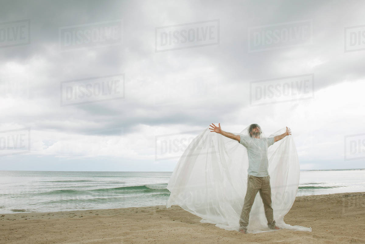 Man with arms outstretched trapped in plastic - Royalty-free Stock ...