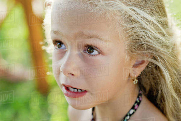 Littel girl looking up anxiously, portrait - Royalty-free Stock Photo ...
