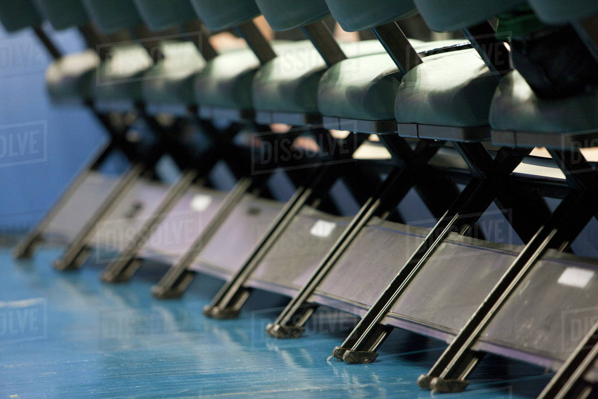 Chairs in a row, low angle view - Royalty-free Stock Photo | Dissolve