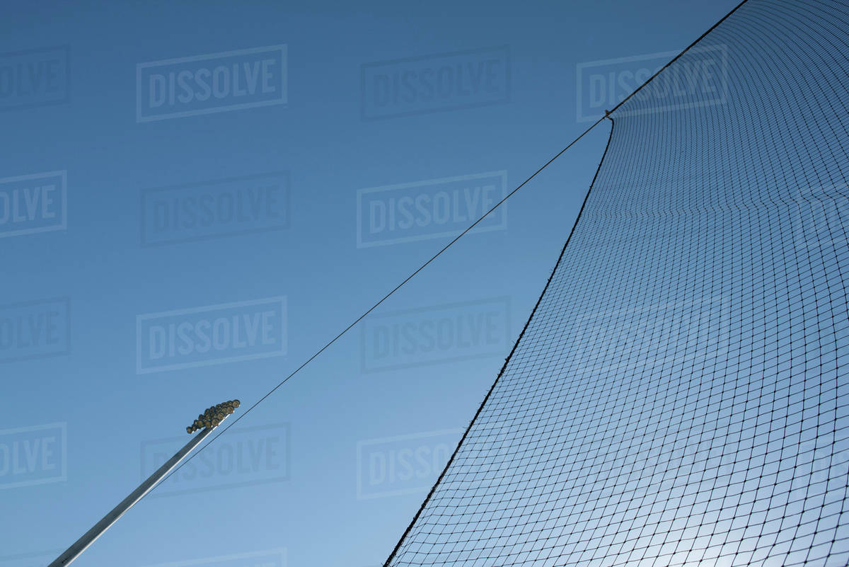 Sports net against blue sky - Stock Photo - Dissolve