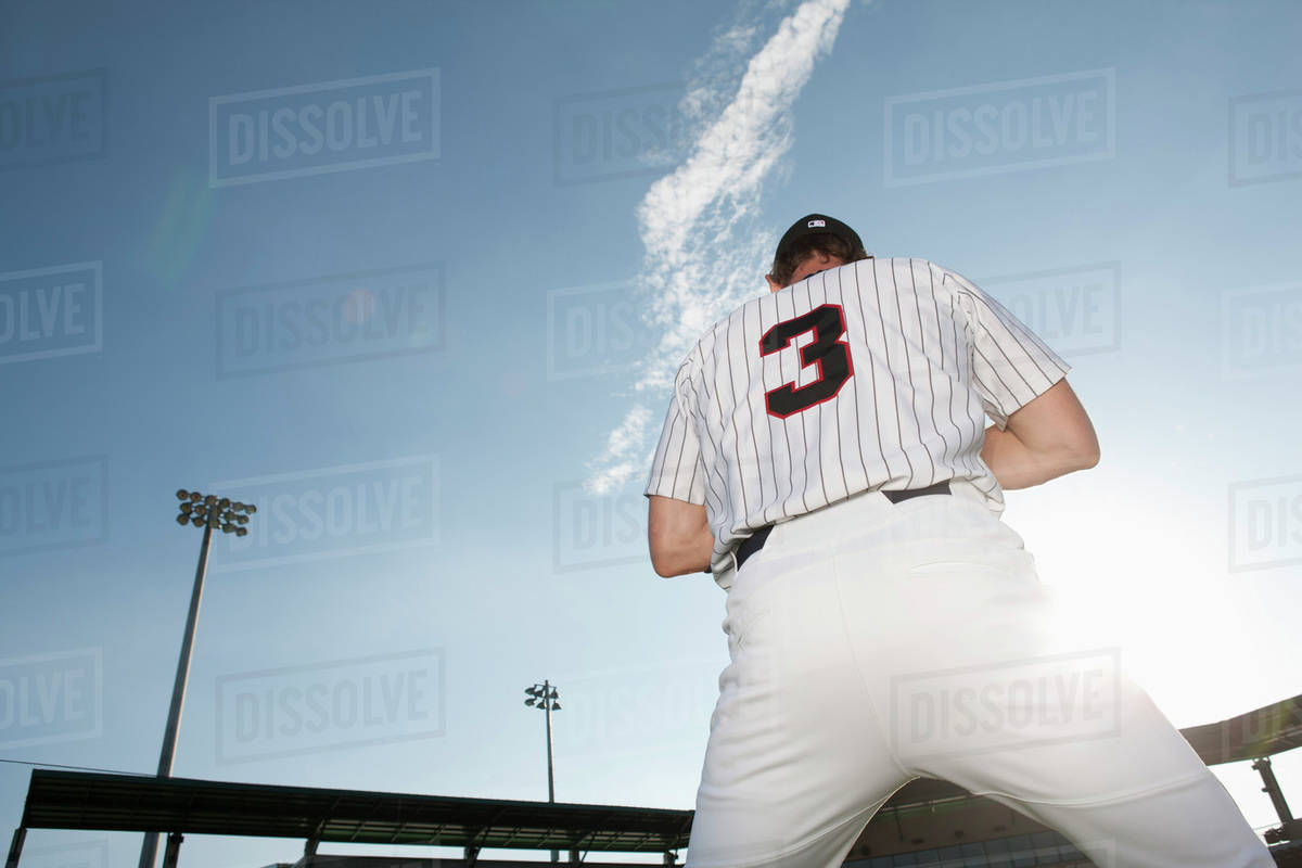 Baseball player, rear view - Stock Photo - Dissolve