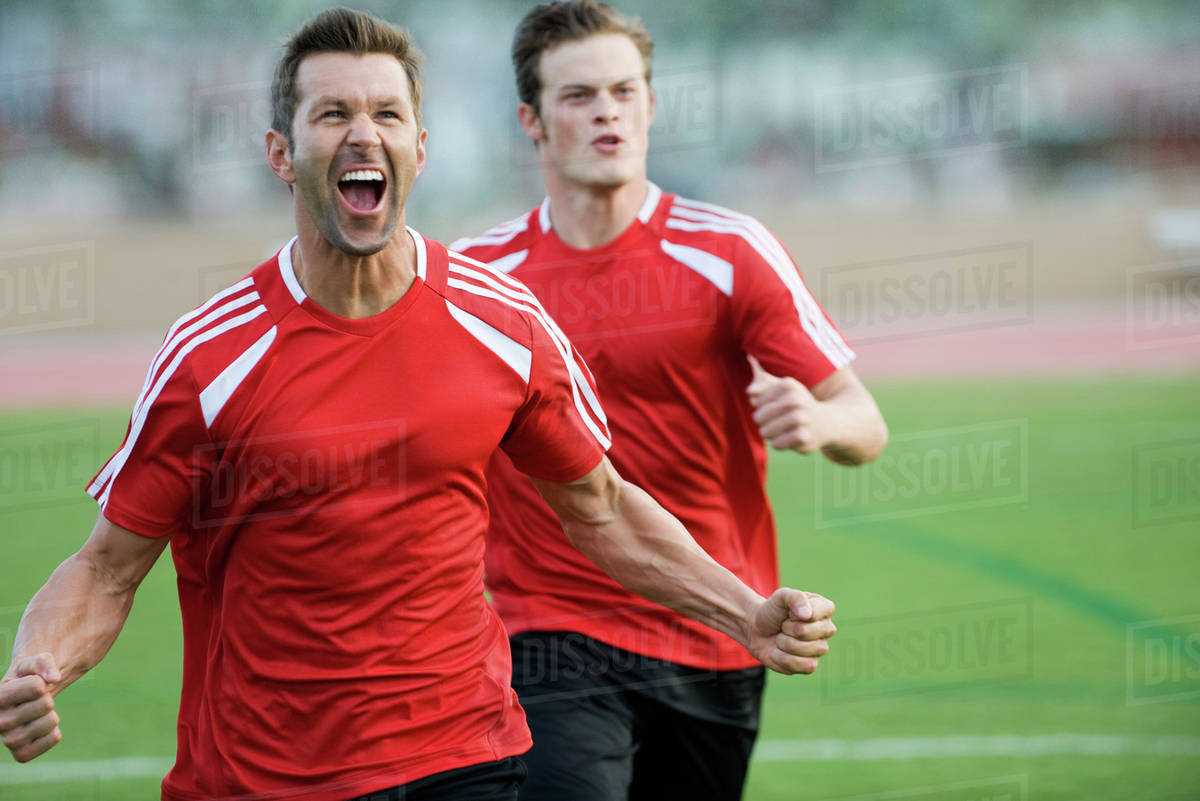 Soccer players cheering - Royalty-free Stock Photo | Dissolve
