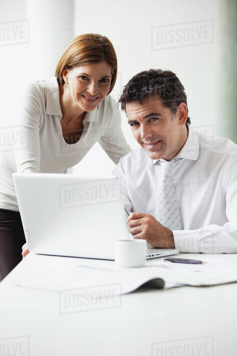 Business colleagues collaborating - Stock Photo - Dissolve