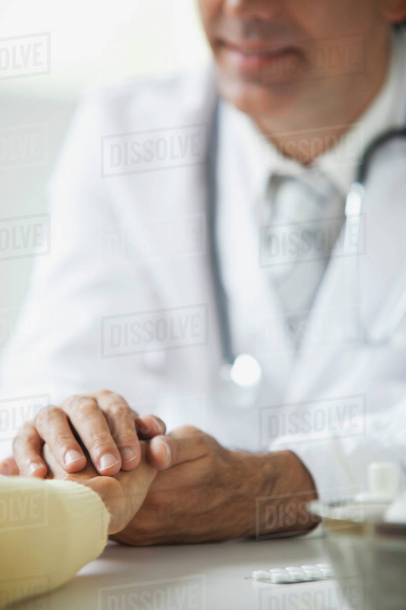 Doctor reassuring patient during consultation, cropped - Stock Photo ...
