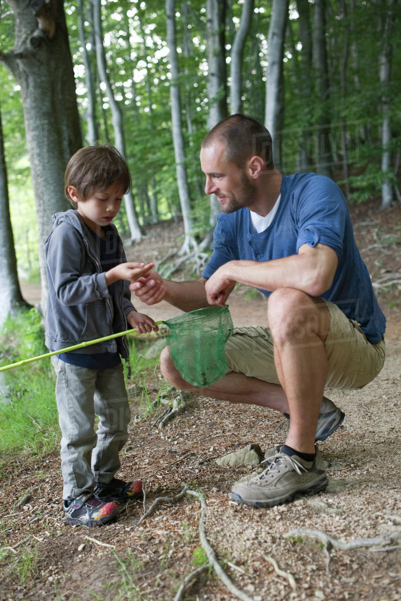 Father and son in woods - Royalty-free Stock Photo | Dissolve
