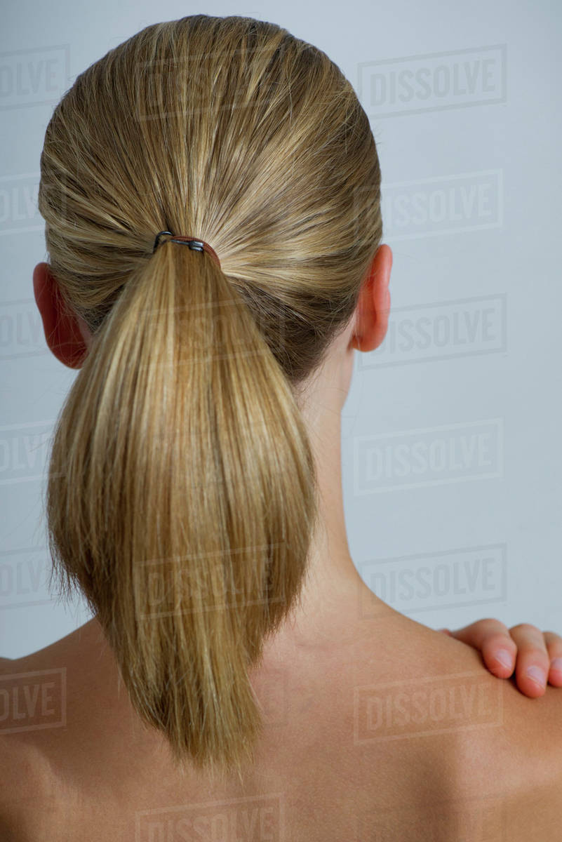 Woman with ponytail, rear view - Royalty-free Stock Photo | Dissolve