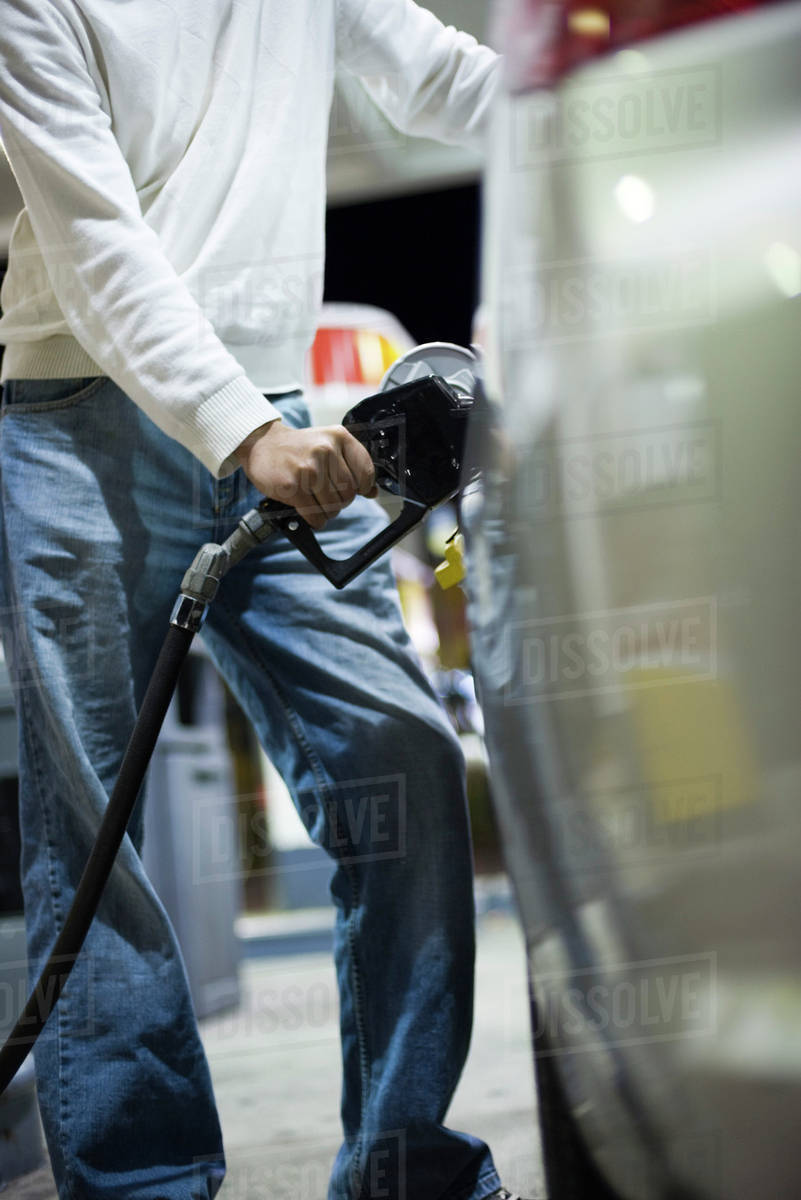 Driver refueling car - Royalty-free Stock Photo | Dissolve