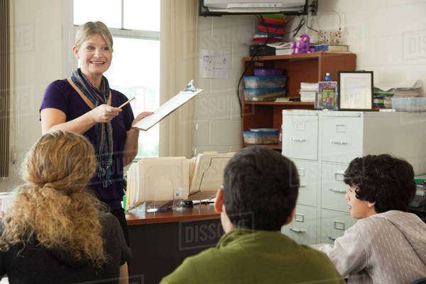 High school teacher addressing students in class - Royalty-free Stock ...