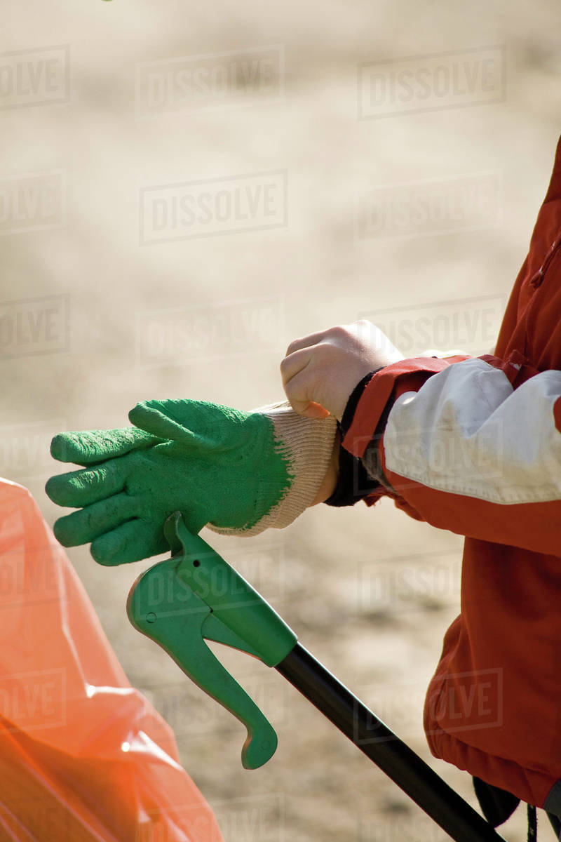 Putting on glove - Royalty-free Stock Photo | Dissolve
