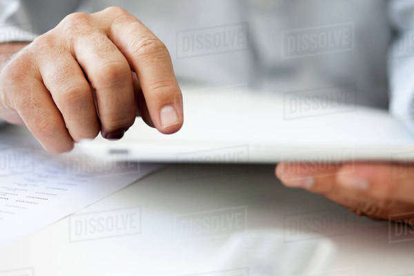 Man's hands holding digital tablet, cropped - Royalty-free Stock Photo ...