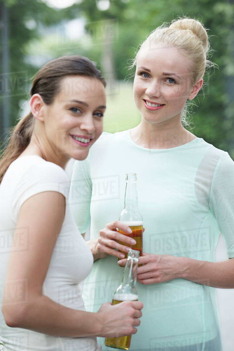 Friends drinking beer together - Royalty-free Stock Photo | Dissolve
