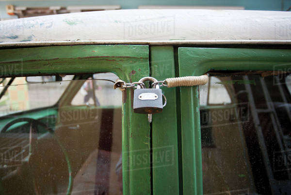 Car locked with padlock - Stock Photo - Dissolve