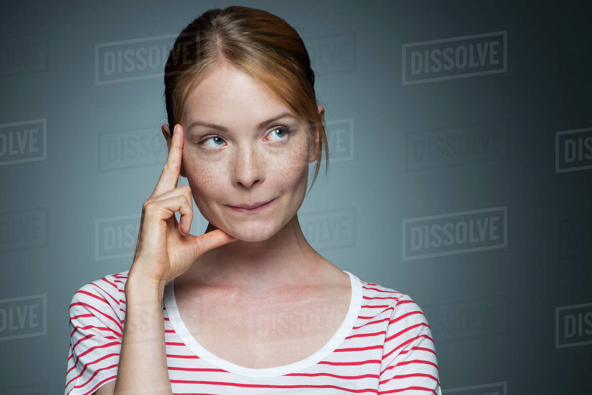 Young woman contemplating - Royalty-free Stock Photo | Dissolve