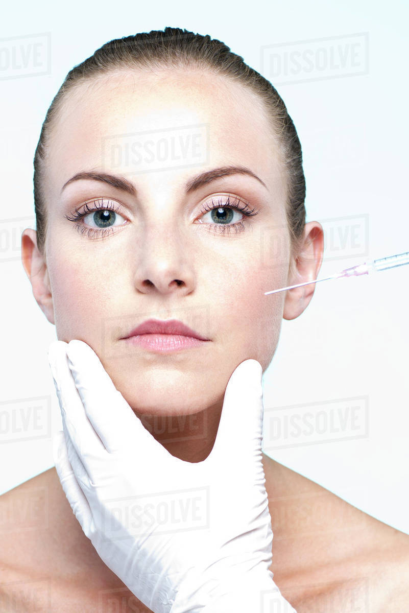 Woman receiving collagen injection - Royalty-free Stock Photo | Dissolve