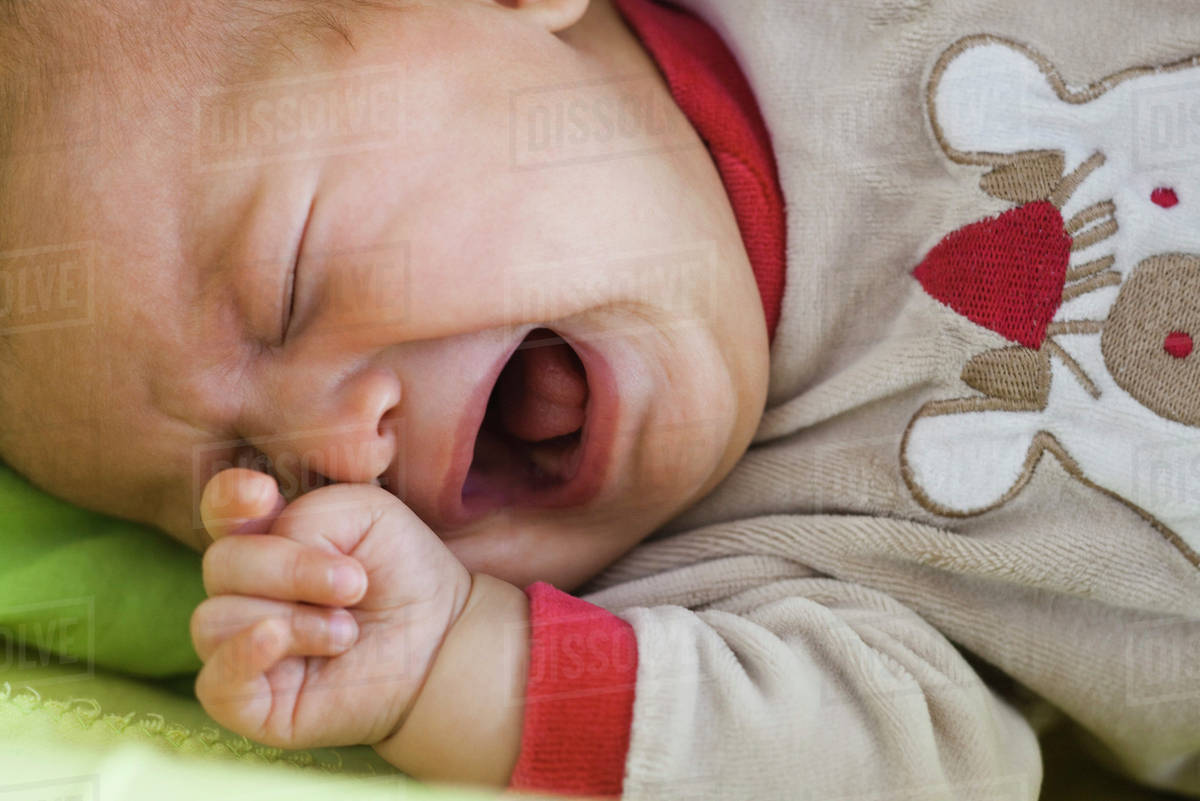 Baby crying, portrait - Royalty-free Stock Photo | Dissolve