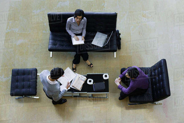 Executives working together, overhead view - Stock Photo - Dissolve