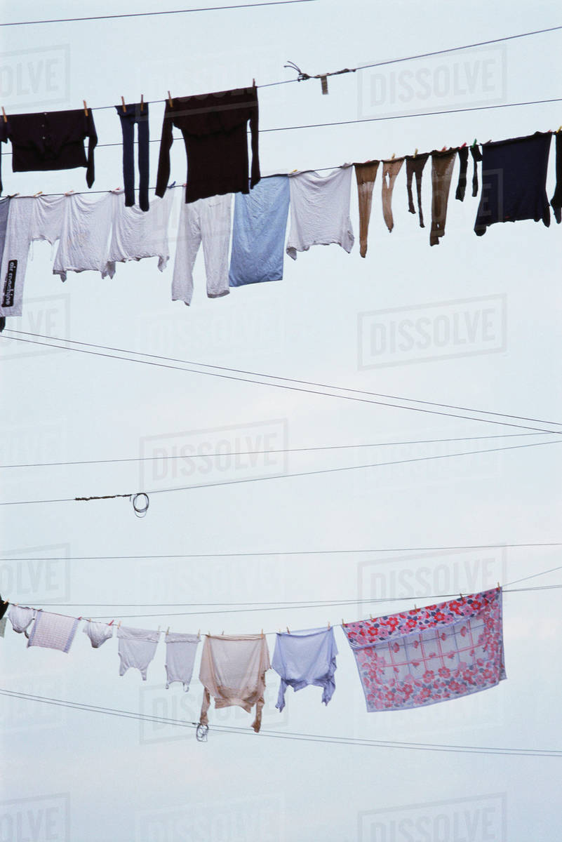 Laundry hanging on clothes-lines - Stock Photo - Dissolve
