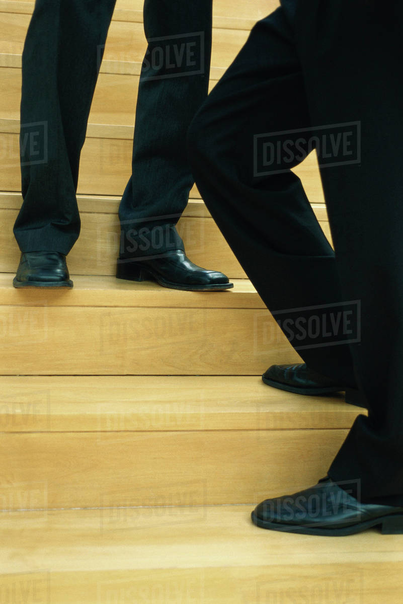 Businessmen standing on steps, low-section - Royalty-free Stock Photo ...