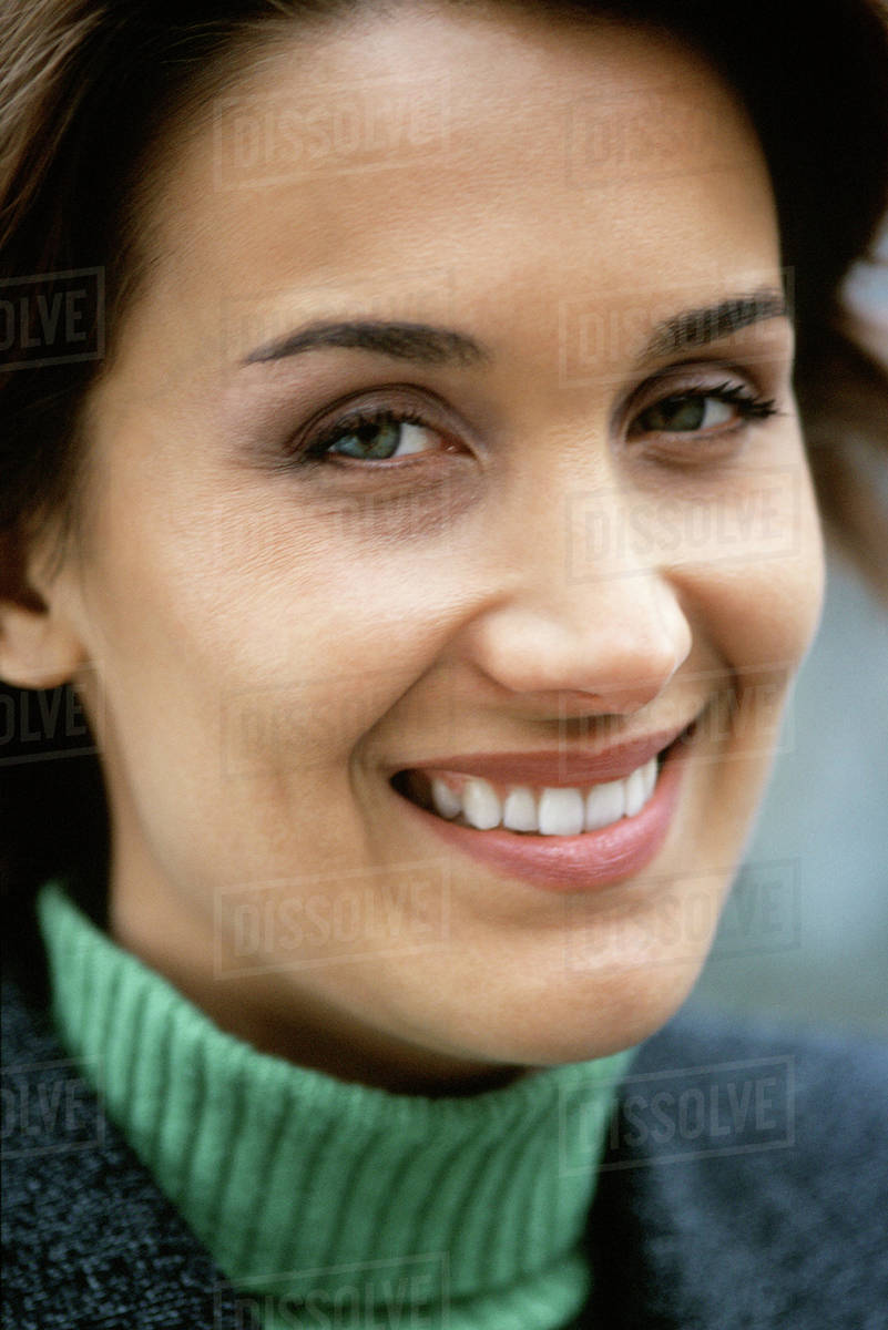 Woman smiling at camera with amusement, portrait - Royalty-free Stock ...