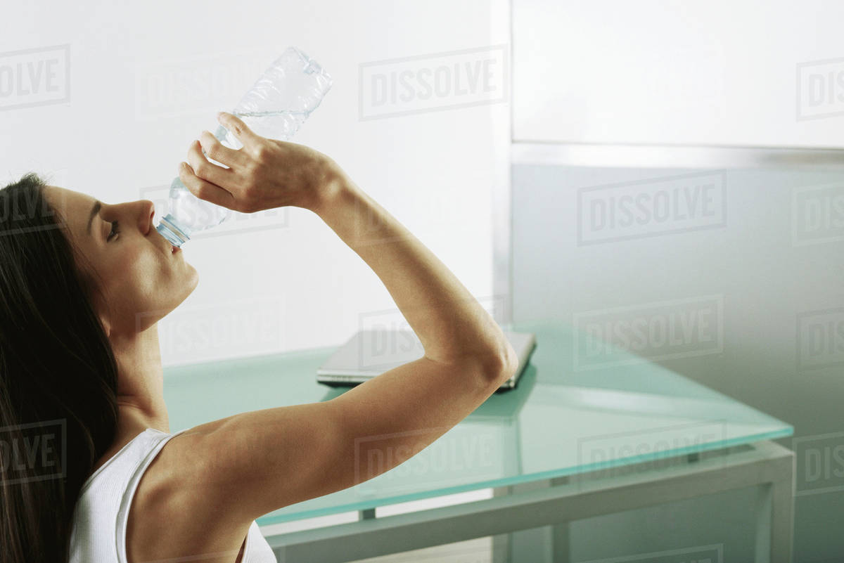 Woman quenching thirst - Royalty-free Stock Photo | Dissolve