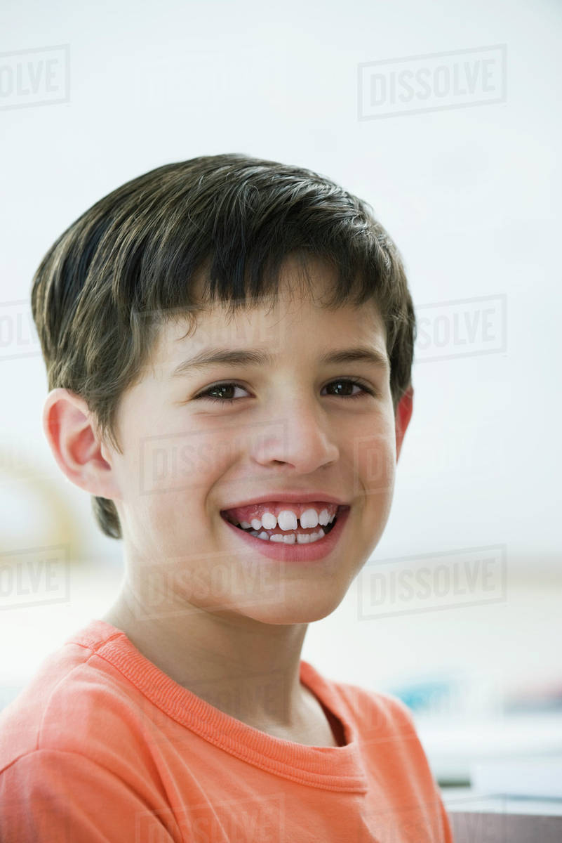 Boy smiling, portrait - Royalty-free Stock Photo | Dissolve