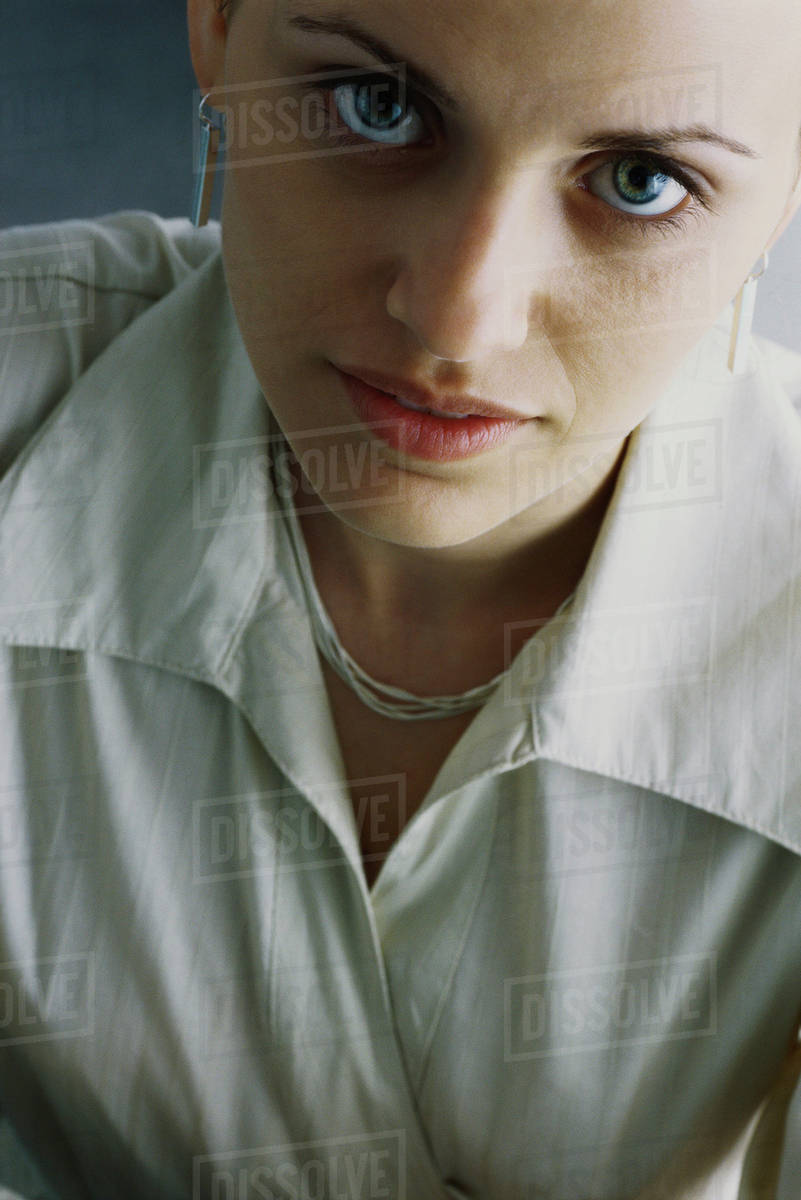 Young woman looking at camera, high angle view, portrait - Royalty-free ...