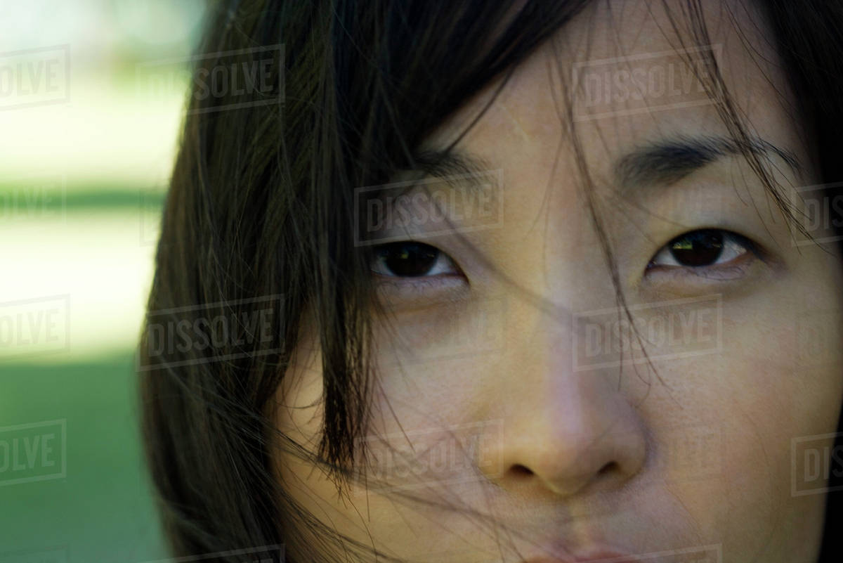Young woman looking at camera, close-up of face - Royalty-free Stock ...