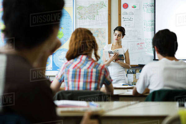 High school student reading book aloud to class - Royalty-free Stock ...