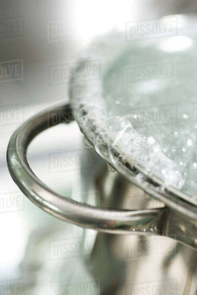Pot boiling over - Royalty-free Stock Photo | Dissolve