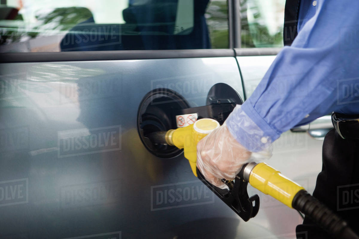 Refueling vehicle at gas station - Stock Photo - Dissolve