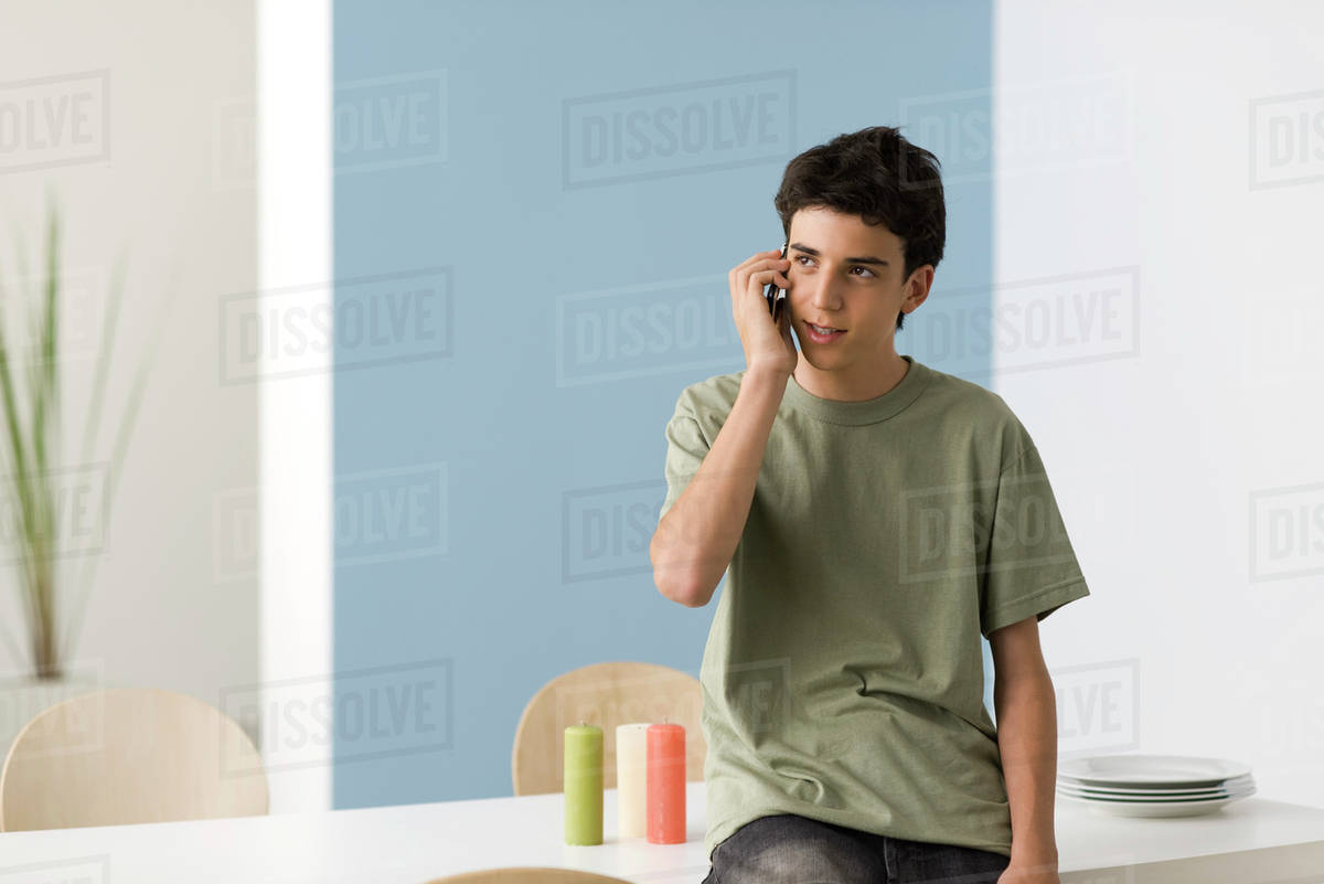 Teenage boy using cell phone - Royalty-free Stock Photo | Dissolve