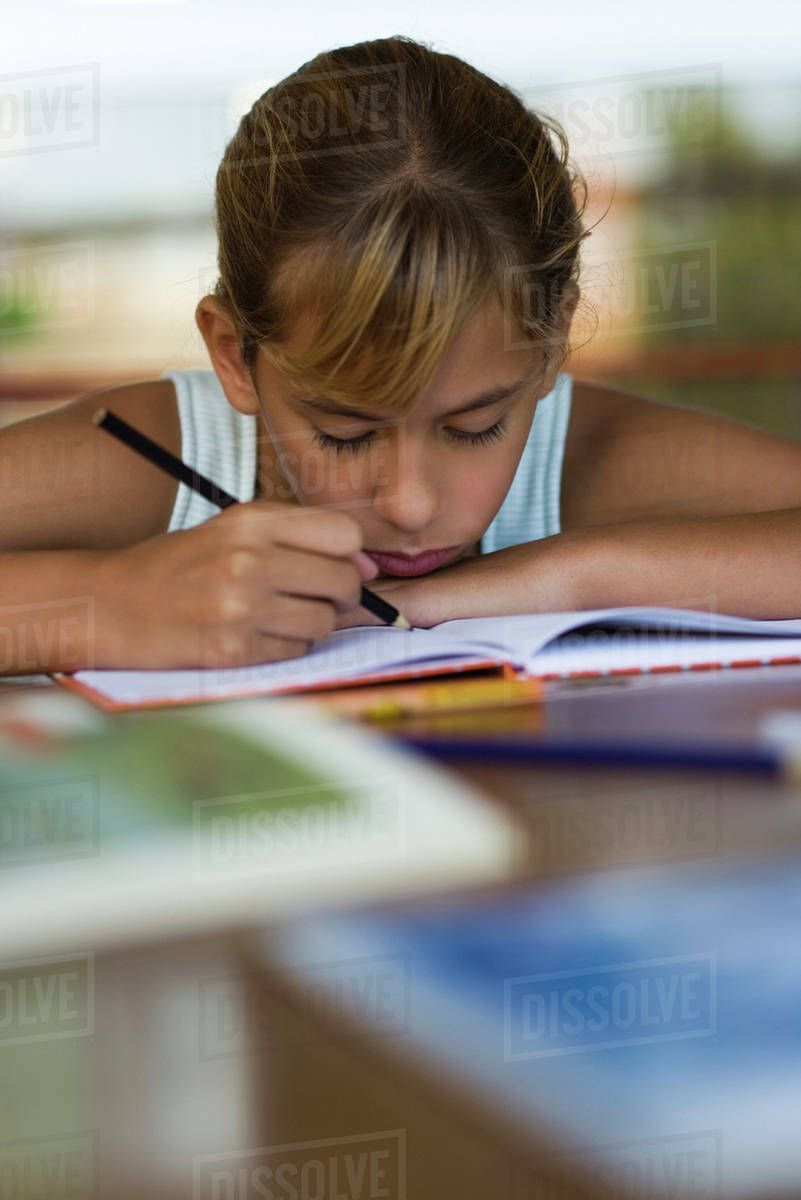 Elementary school student concentrating on school work - Royalty-free ...