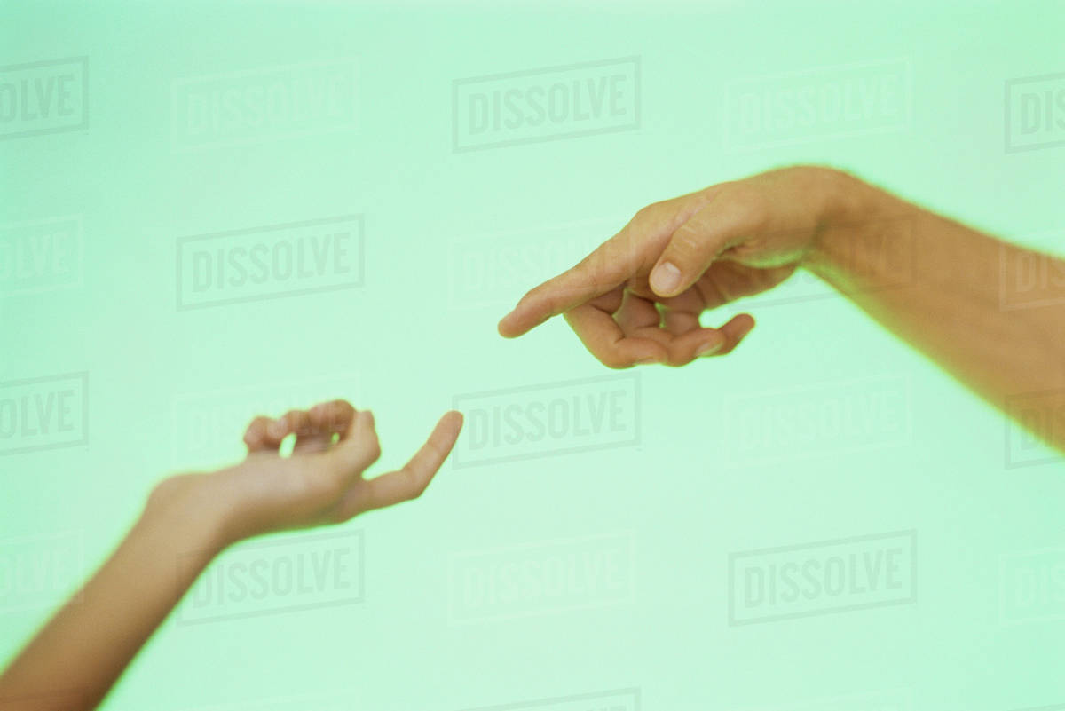 Two hands reaching toward each other with index fingers extended ...