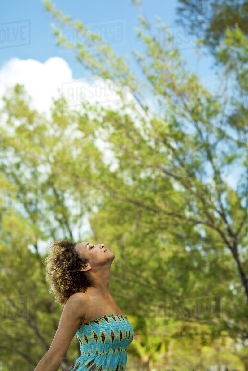 Woman enjoying fresh air outdoors - Royalty-free Stock Photo | Dissolve