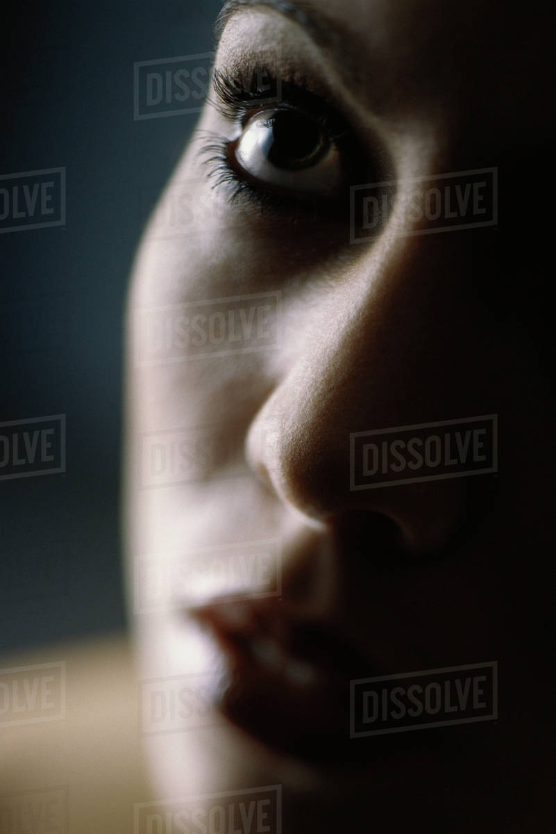 Woman's face, looking up, close-up - Royalty-free Stock Photo | Dissolve