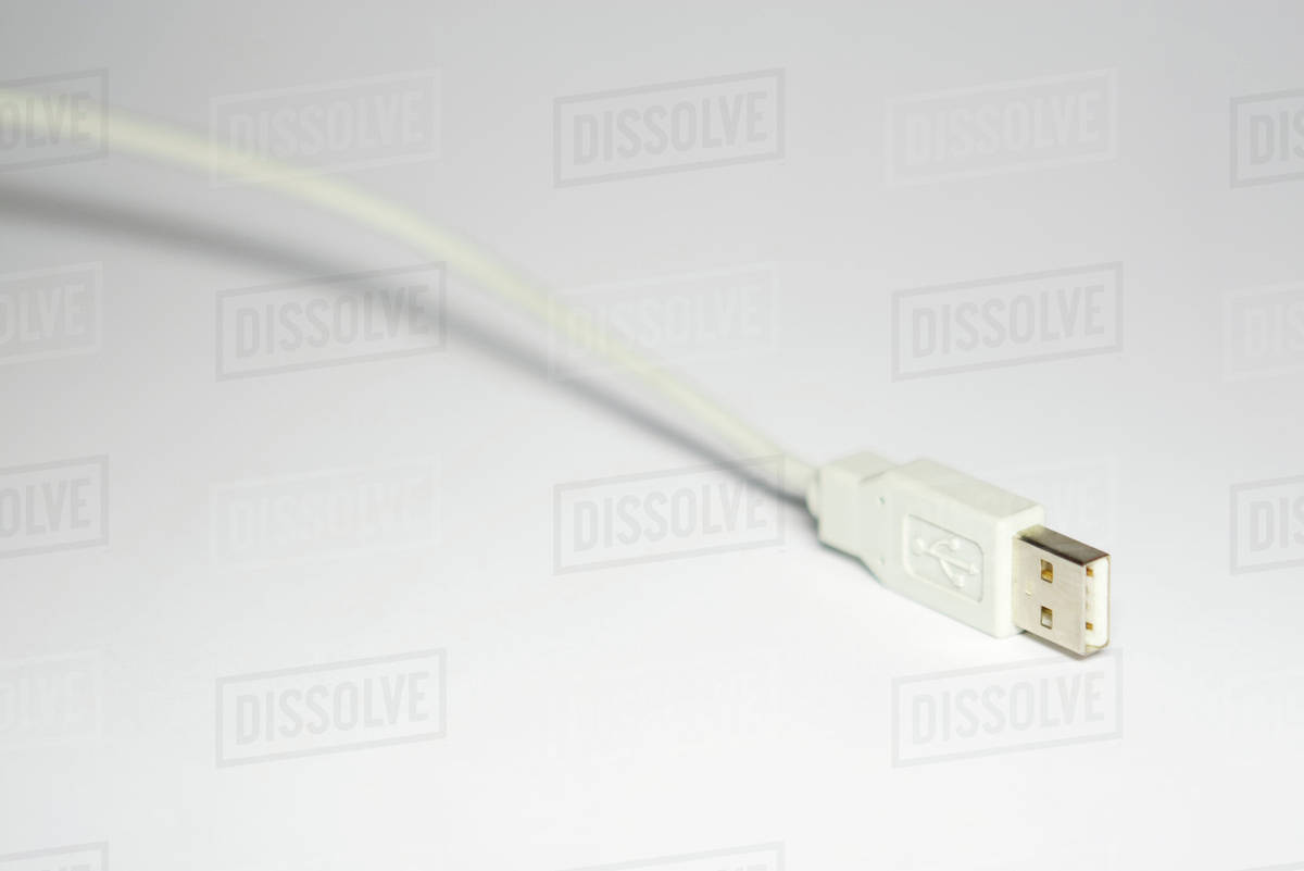 USB cable, close-up - Stock Photo - Dissolve