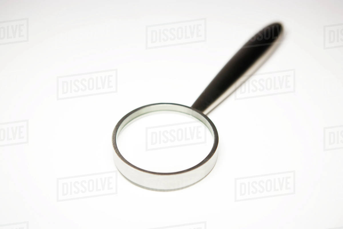 Magnifying glass, close-up - Royalty-free Stock Photo | Dissolve