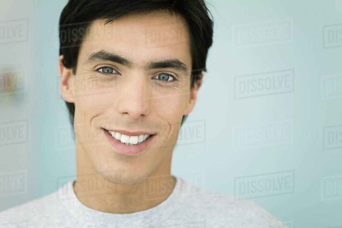 Man smiling at camera, portrait - Royalty-free Stock Photo | Dissolve
