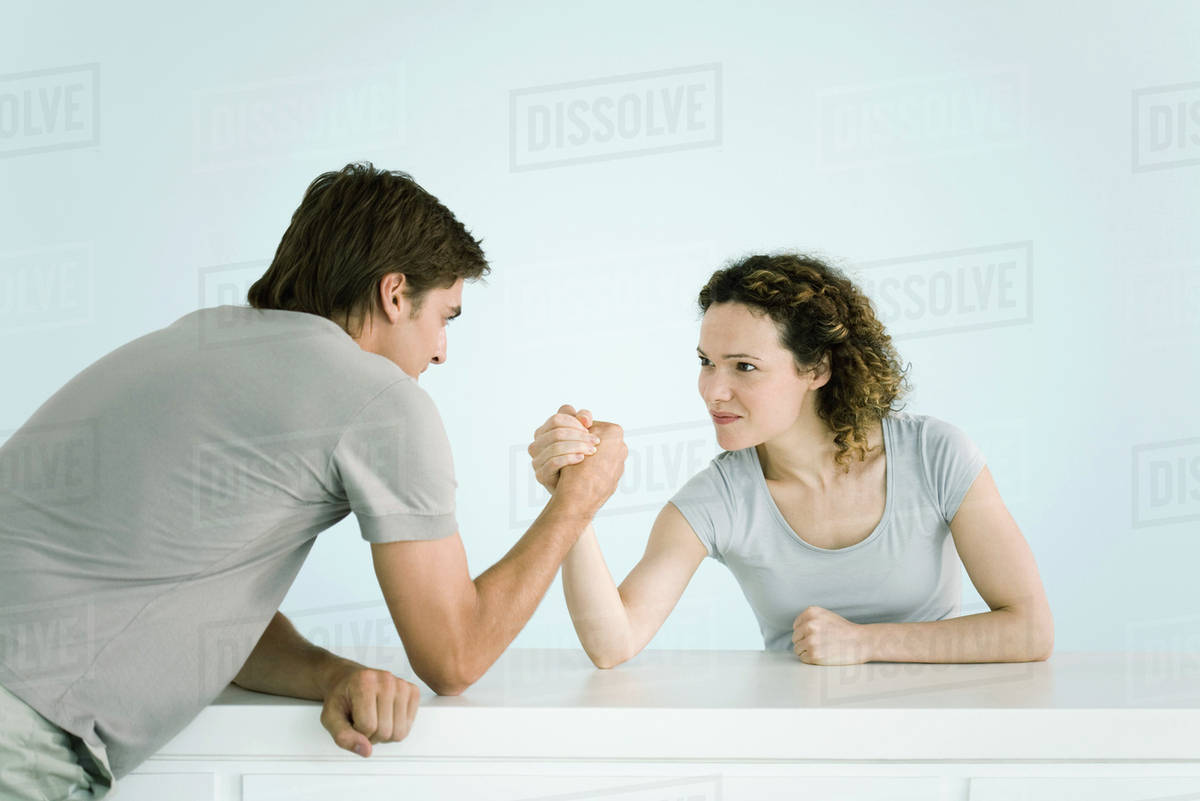 Couple arm wrestling together - Royalty-free Stock Photo | Dissolve