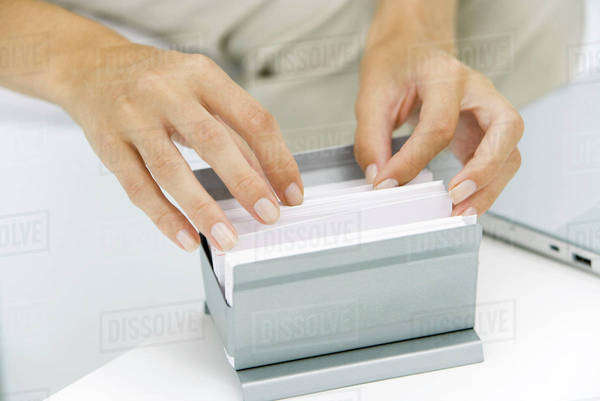 Hands flipping through card file, close-up - Royalty-free Stock Photo ...