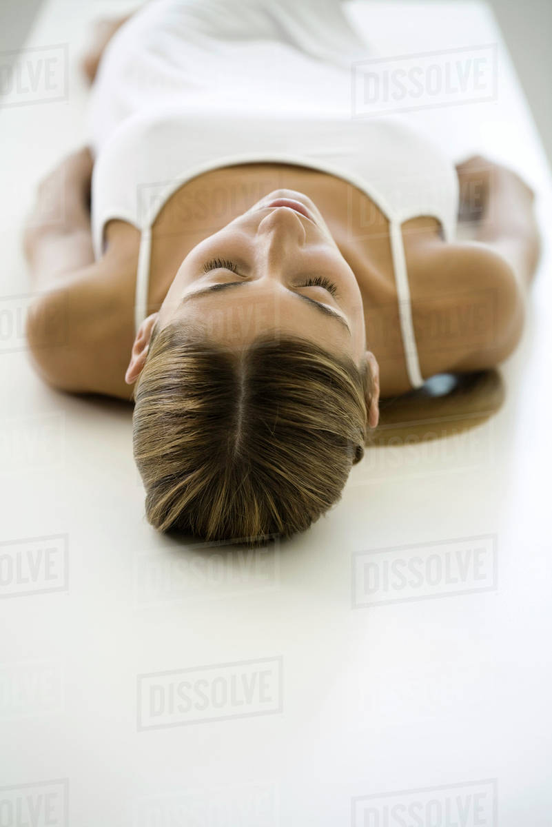 Woman lying on back, rear view - Royalty-free Stock Photo | Dissolve