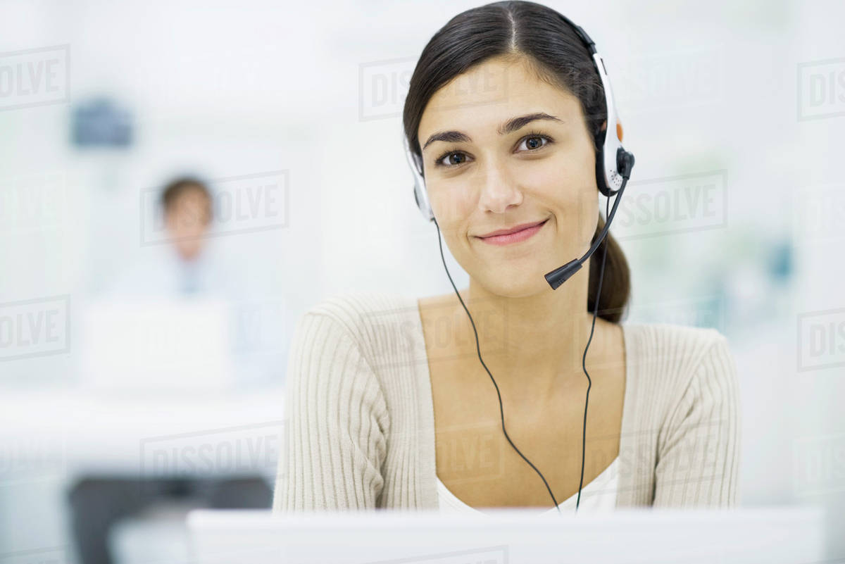 Young female telemarketer - Royalty-free Stock Photo | Dissolve