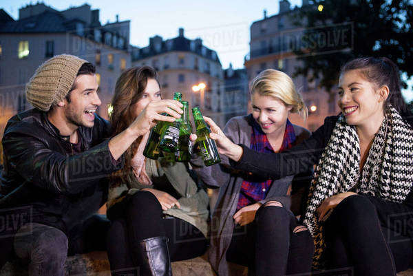 Friends celebrating together outdoors - Royalty-free Stock Photo | Dissolve