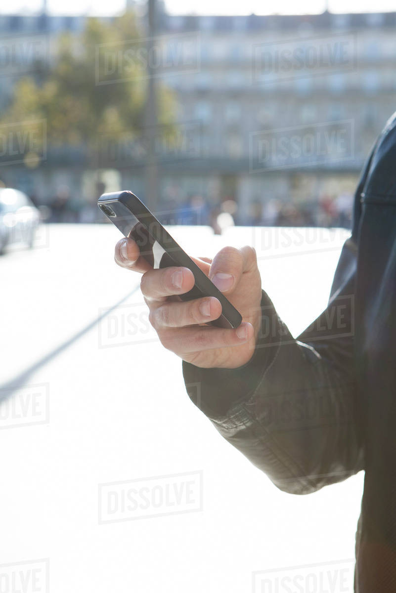 Person using smartphone - Royalty-free Stock Photo | Dissolve