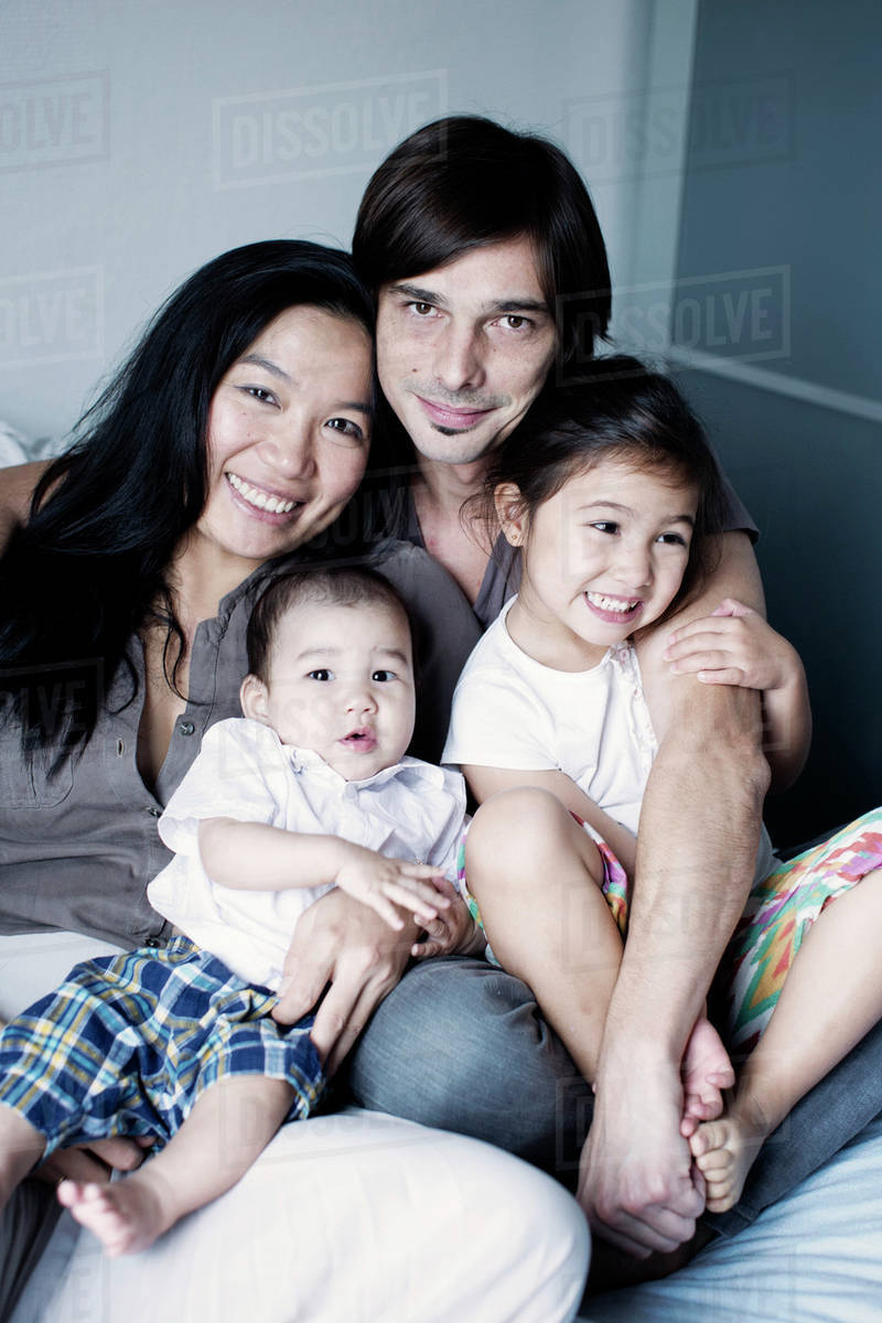Family with two children, portrait - Stock Photo - Dissolve