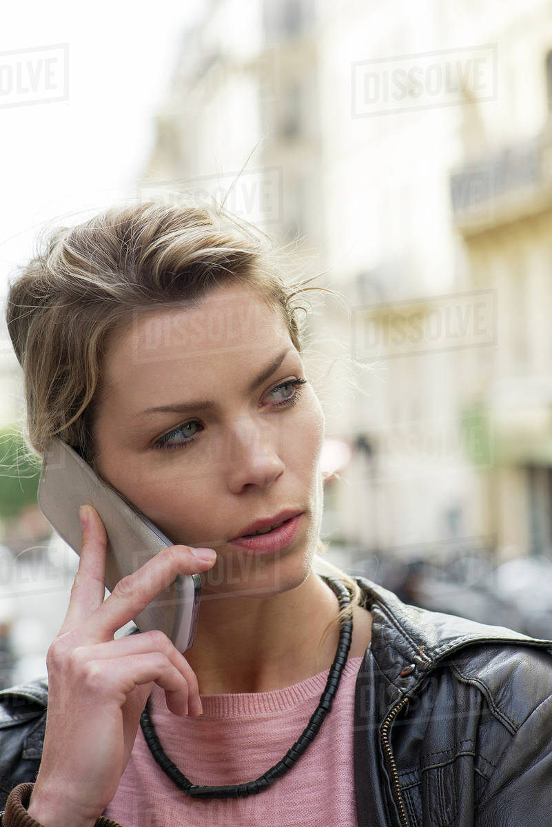 Woman using cell phone - Royalty-free Stock Photo | Dissolve